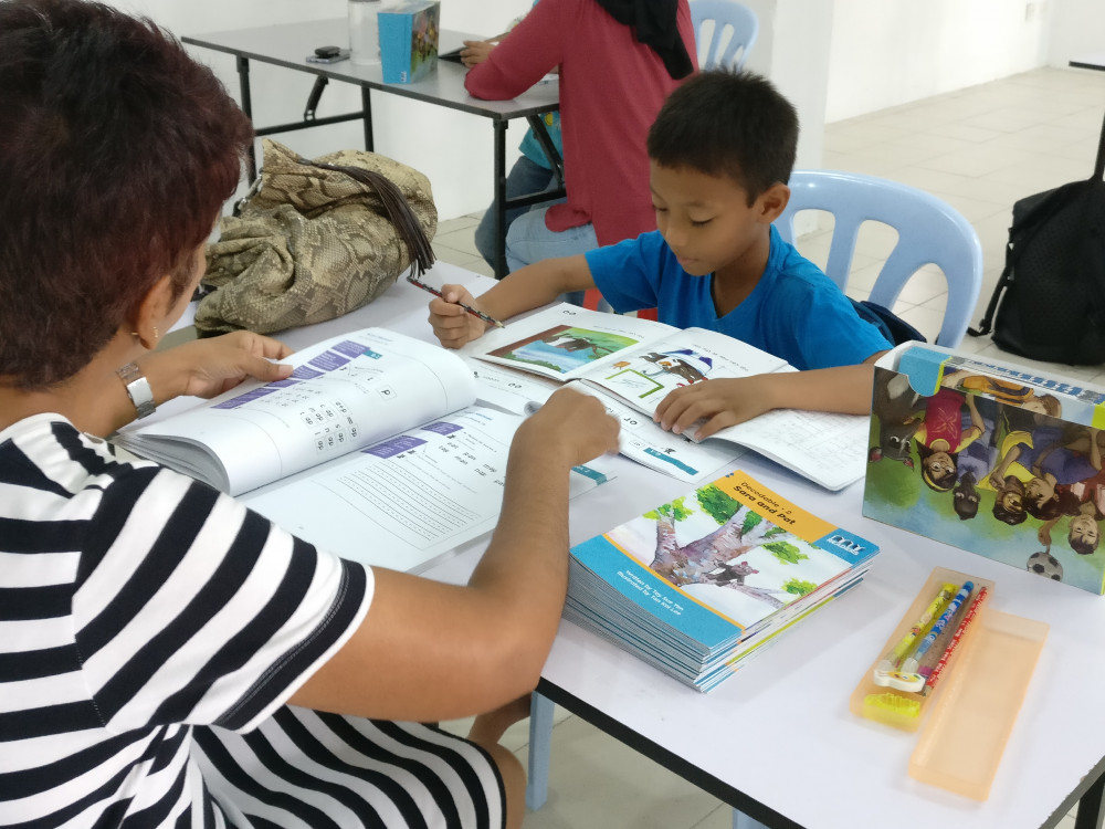 Volunteer to read with a child at Kerinchi Literacy Hub - Missions ...