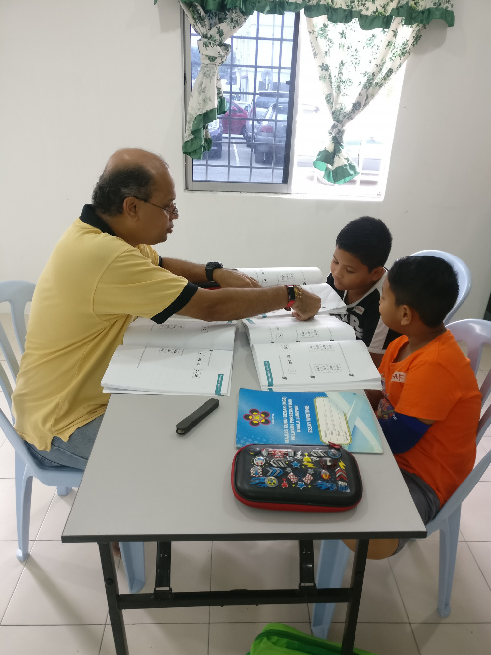 Volunteer to read with a child at Kerinchi Literacy Hub - Missions ...