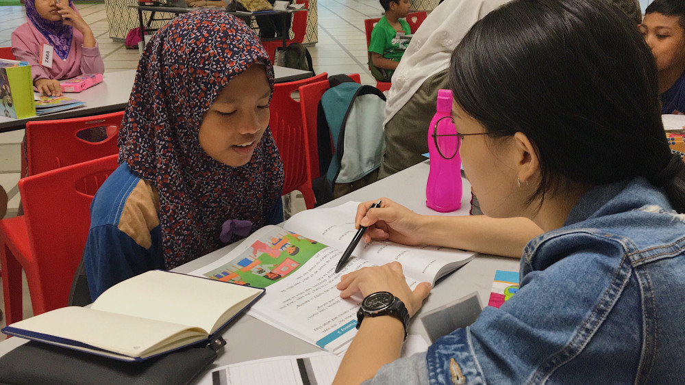 Volunteer to read with a child at Kerinchi Literacy Hub - Missions ...